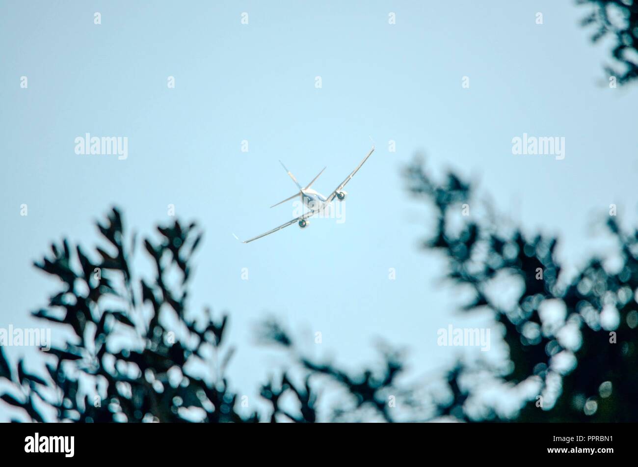 Low Angle View Of Airplane Flying In Sky Stock Photo - Alamy