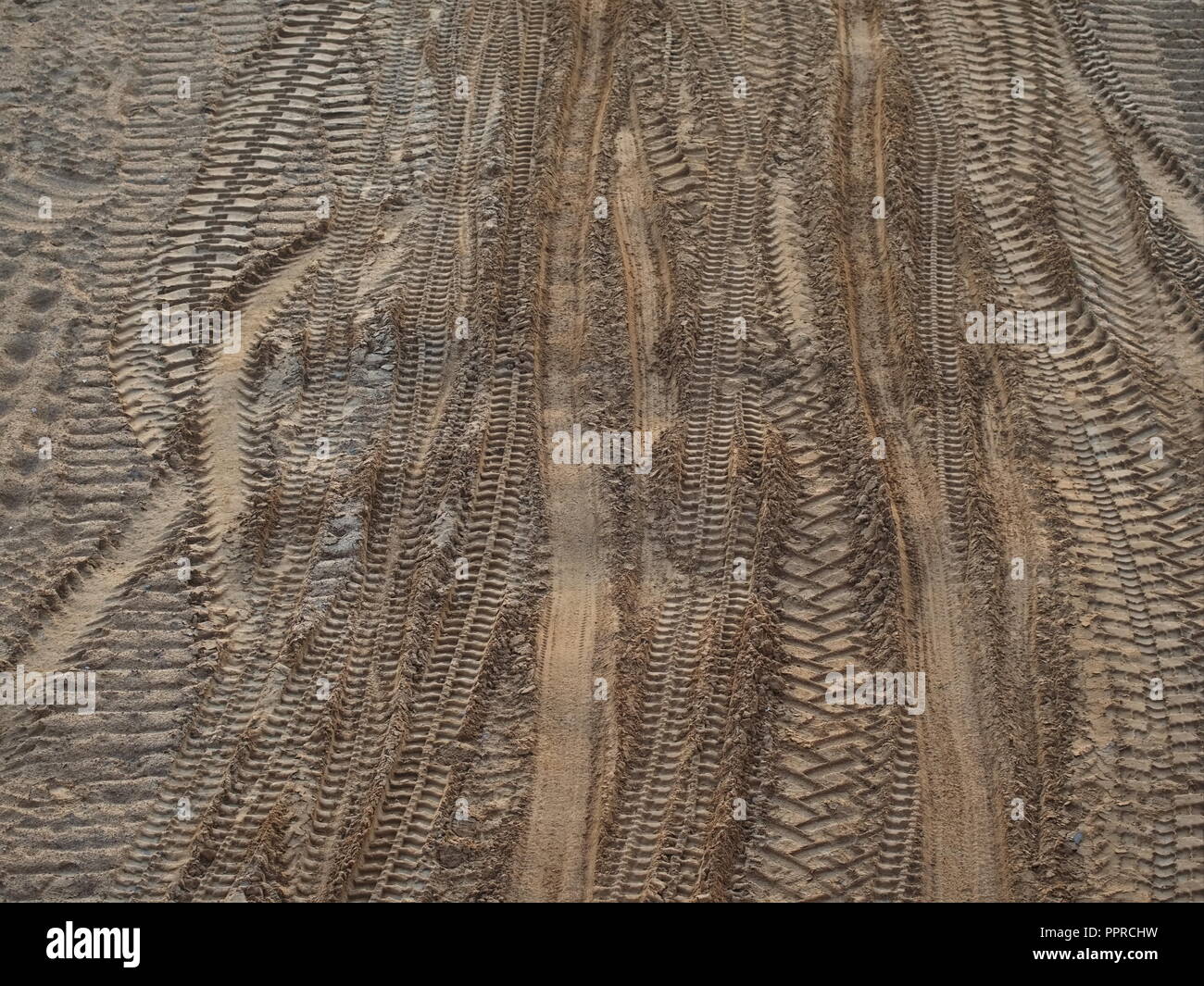 Many different wheel tracks on sand Stock Photo - Alamy