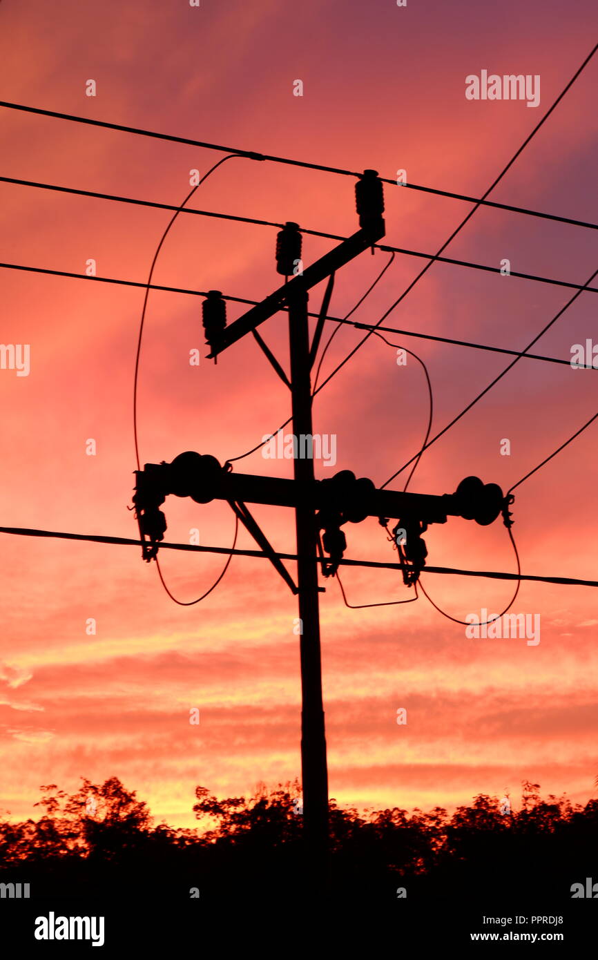 power pole sunset silhouette Stock Photo - Alamy