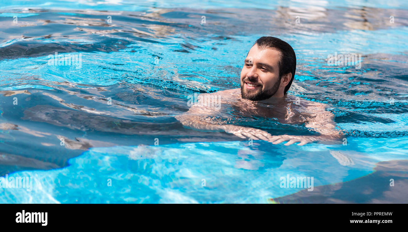 handsome bearded man swimming in pool Stock Photo - Alamy