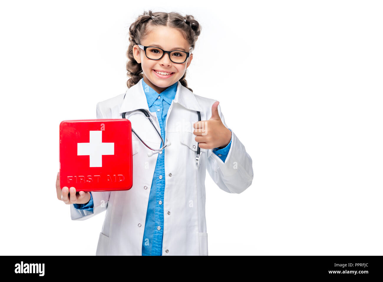 schoolchild in costume of doctor holding first aid kit and showing ...