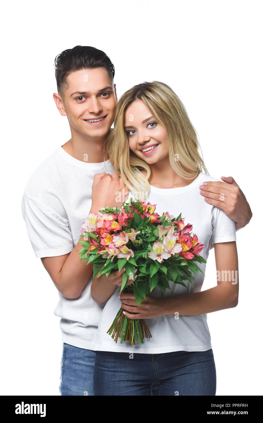 couple hugging and holding bouquet of flowers isolated on white Stock ...