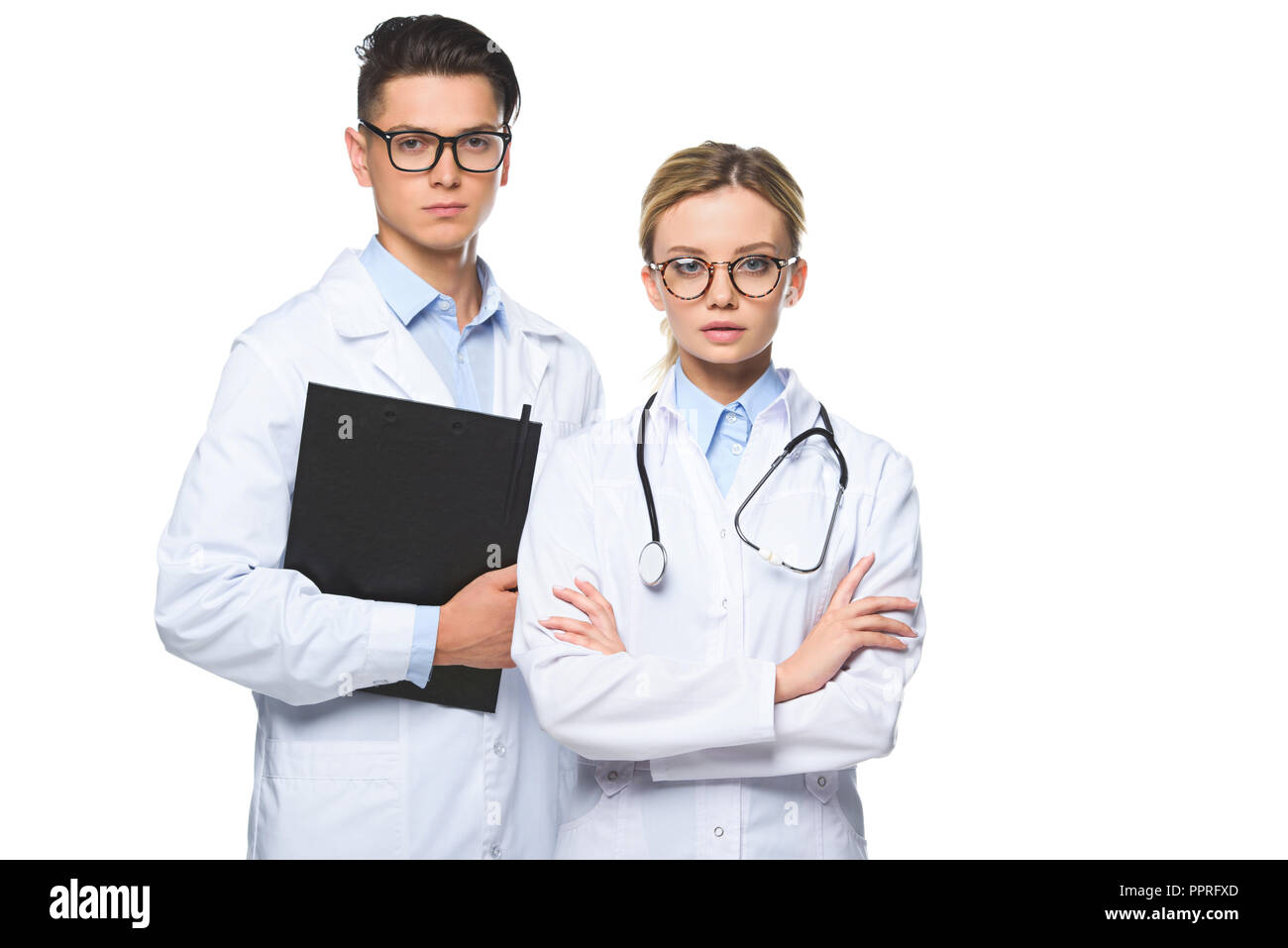 serious doctors standing with stethoscope and clipboard isolated on ...