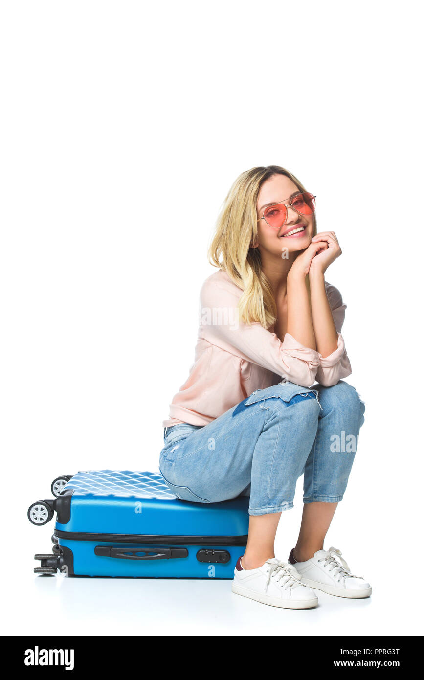 Sitting on luggage hi-res stock photography and images - Alamy
