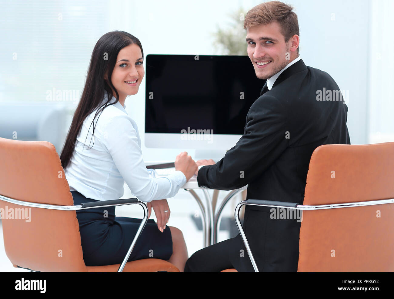 Boss sitting behind desk employee hi-res stock photography and images ...