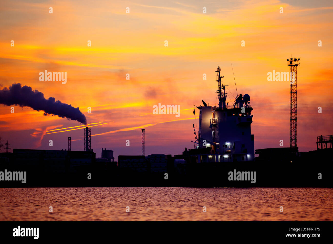 View on seaport with ship silhouette at sunset. Evening panorama of the ...