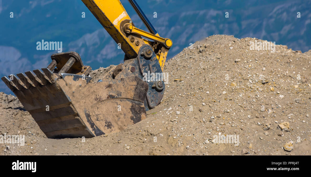 Arm and bucket of heavy duty construction vehicle Stock Photo - Alamy