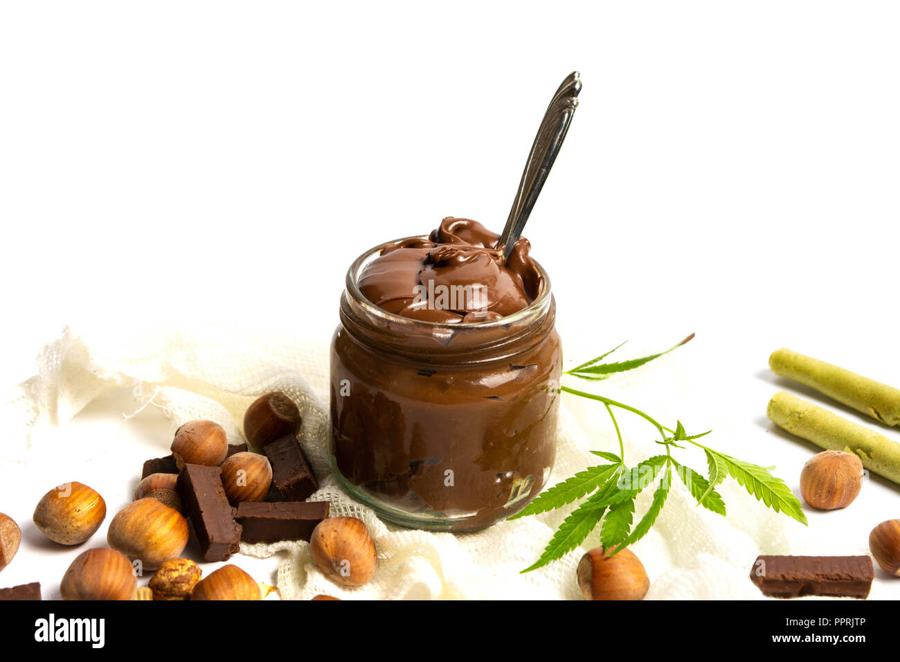 Hazelnut spread with marijuana leaves in a jar isolated Stock Photo - Alamy