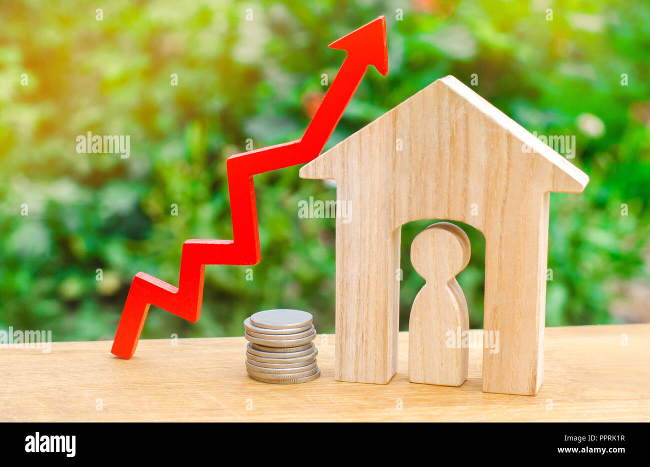 wooden house with a man inside. red arrow up. concept of high demand ...