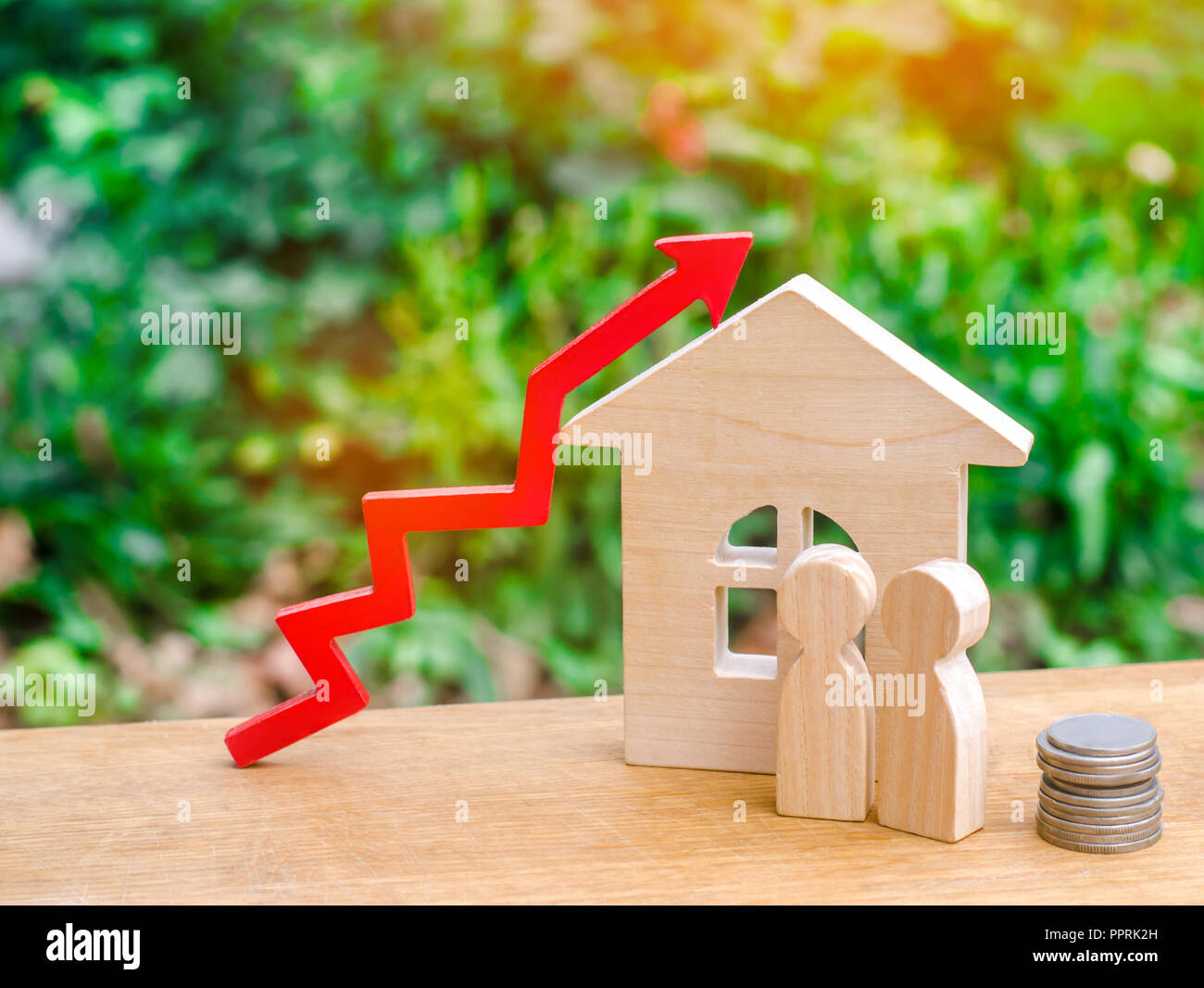 wooden house, money with a red arrow up. concept of high demand for ...