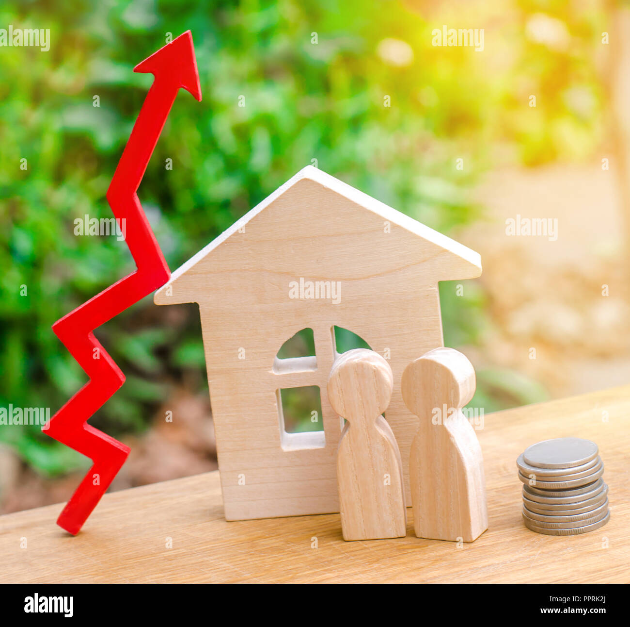 wooden house, money with a red arrow up. concept of high demand for ...