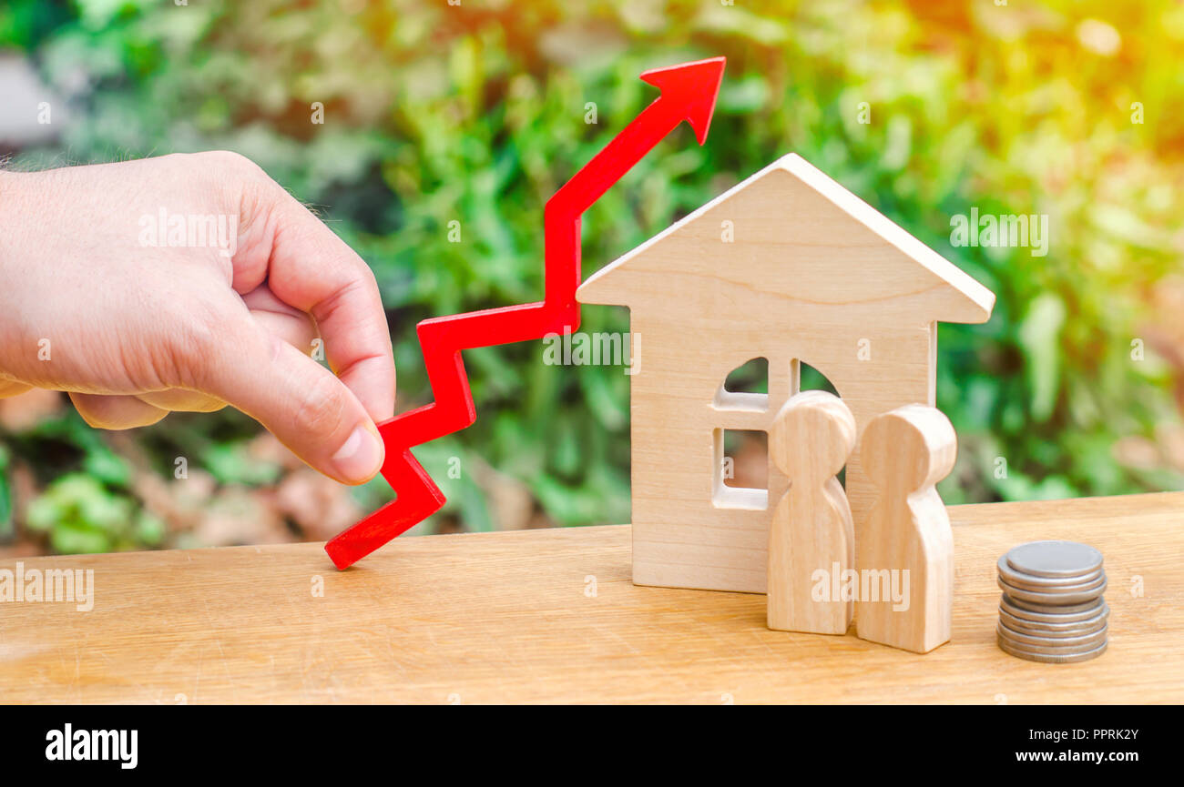 wooden house, money with a red arrow up. concept of high demand for ...