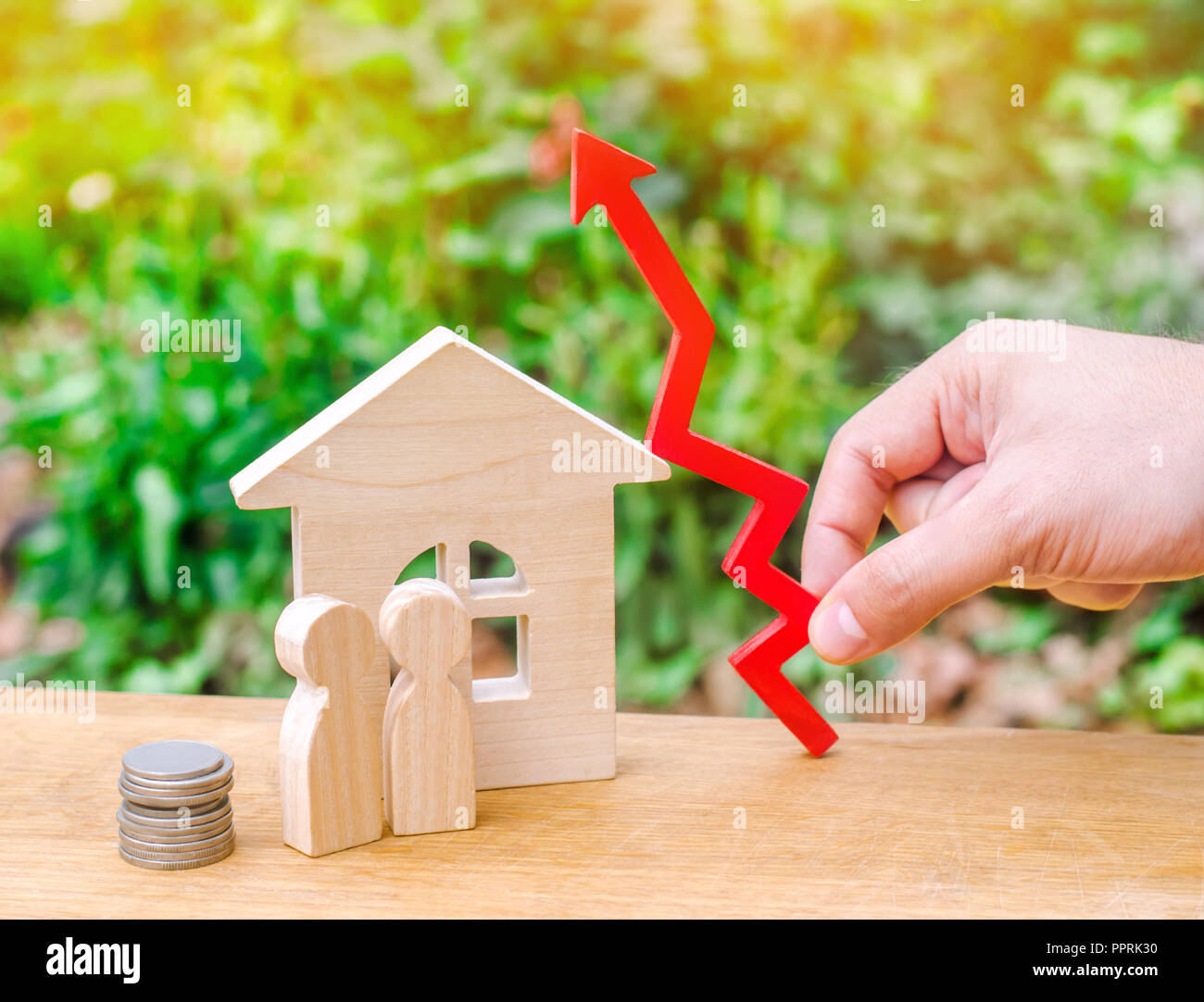 wooden house, money with a red arrow up. concept of high demand for ...