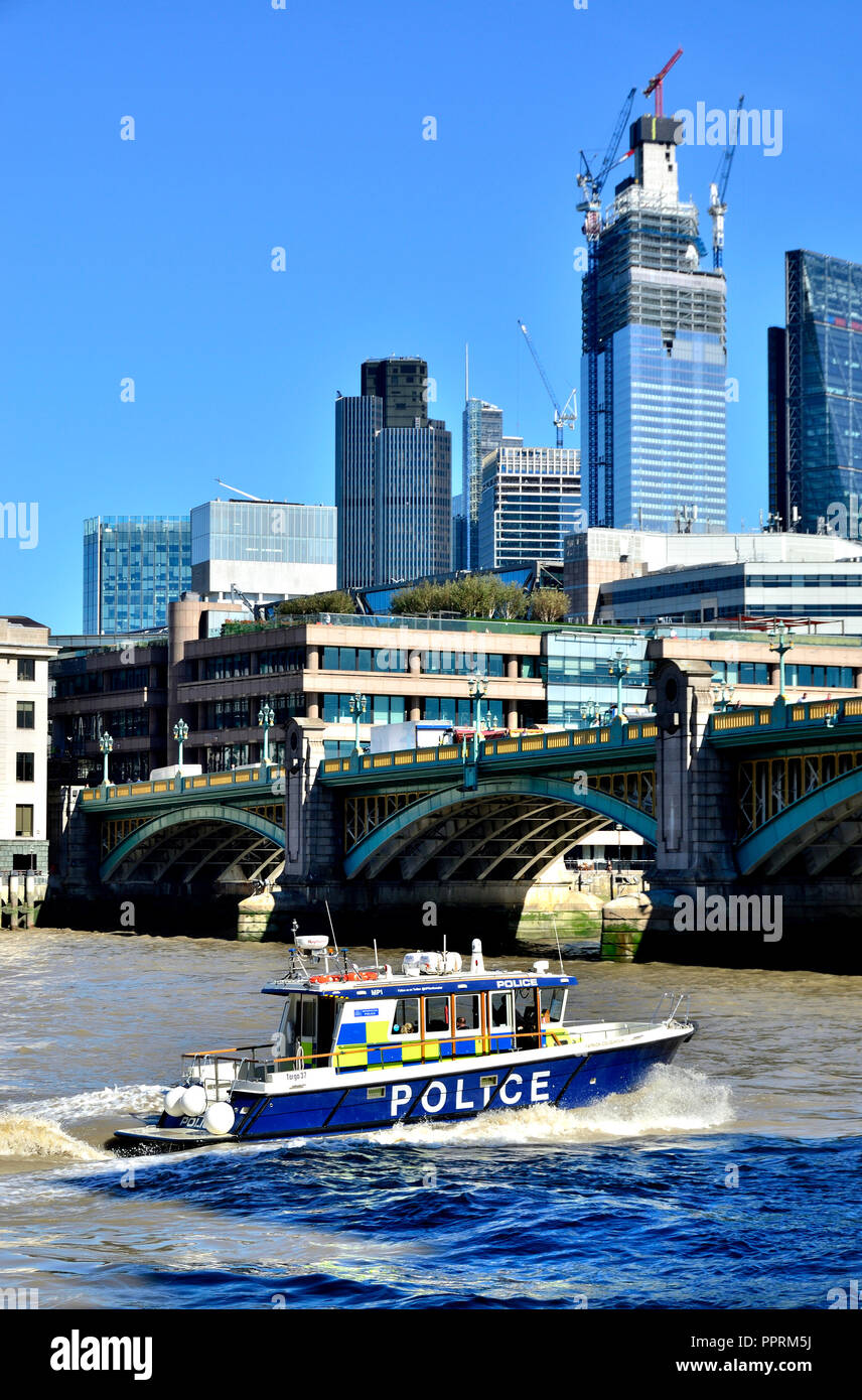 Police Targa 37 launch passing under Southwark Bridge on the River ...