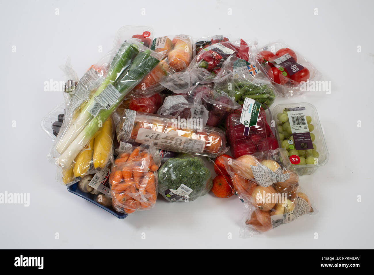Plastic packaging on fruit and vegetables in the UK Stock Photo - Alamy