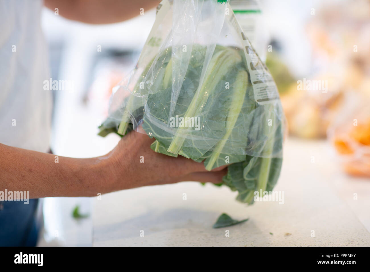 Unpacking plastic wrapped fruit and vegetables in the kitchen - Plastic ...