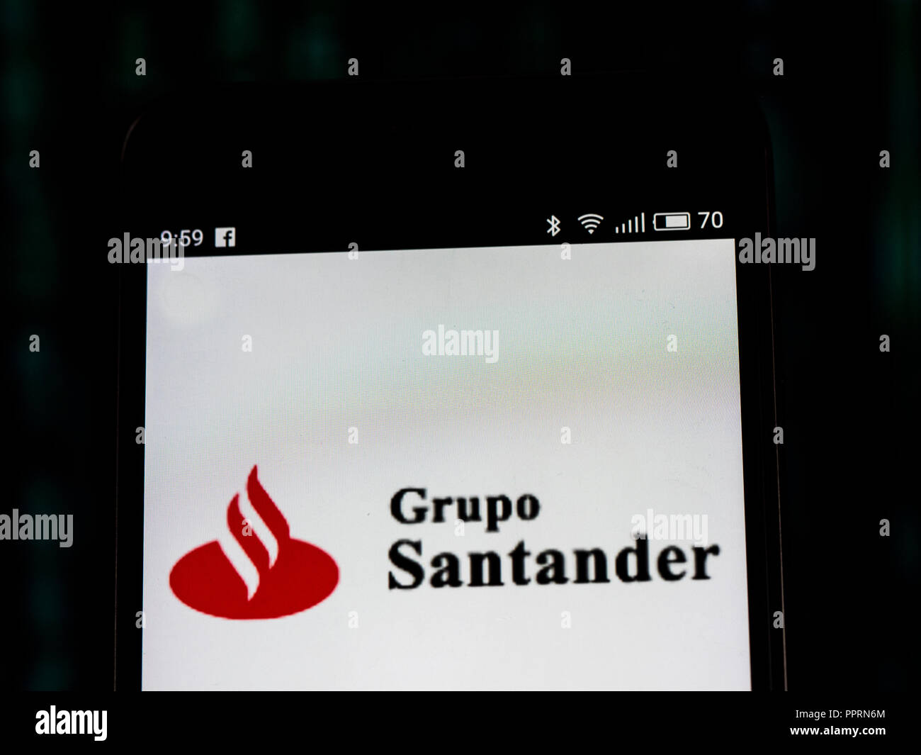 Banco Santander logo seen displayed on smart phone. Santander Group is ...