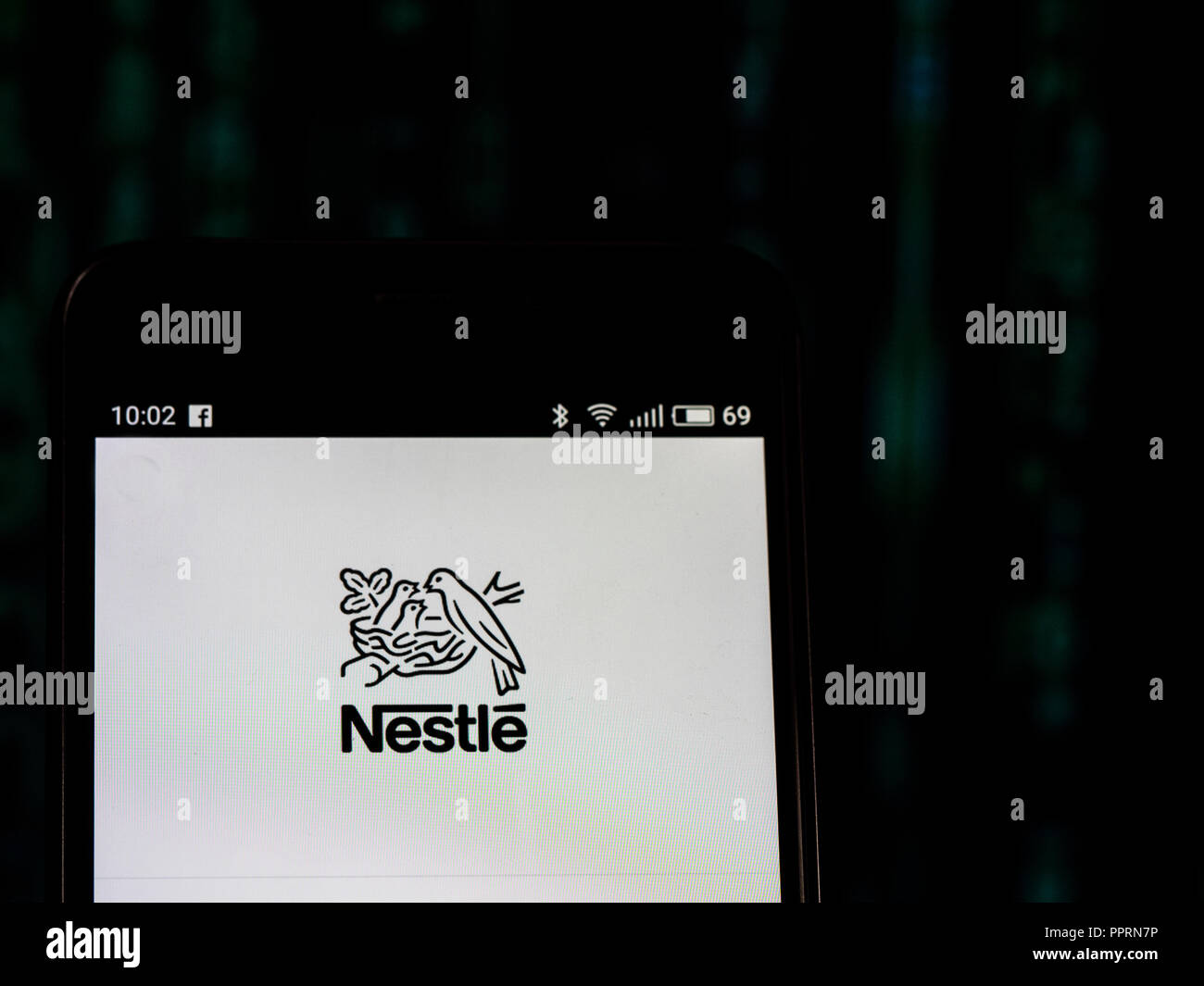 Nestle logo seen displayed on smart phone. Nestle S.A. is a Swiss ...