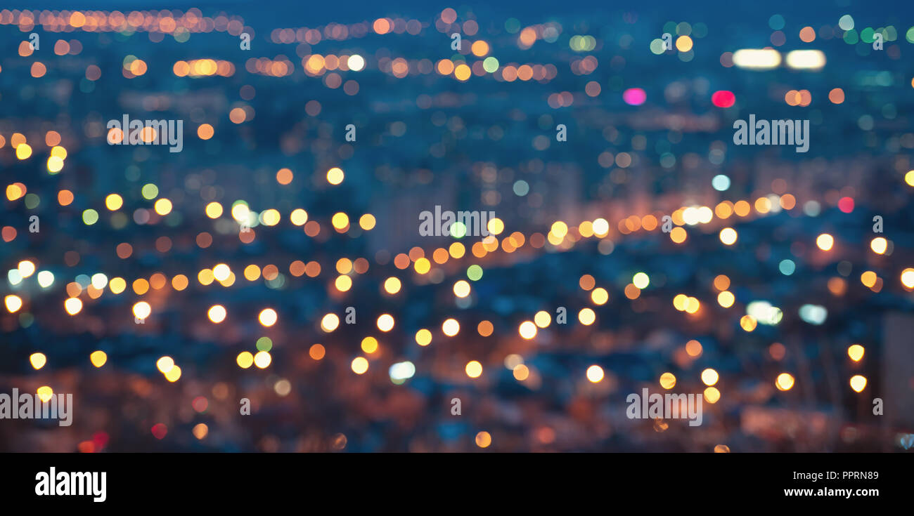 city blurring lights abstract defocused circular bokeh on blue ...