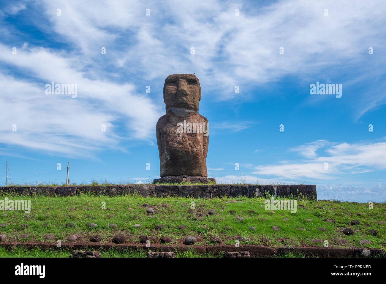 A single Moai statue on an Easter Island altar looks inward Stock Photo ...
