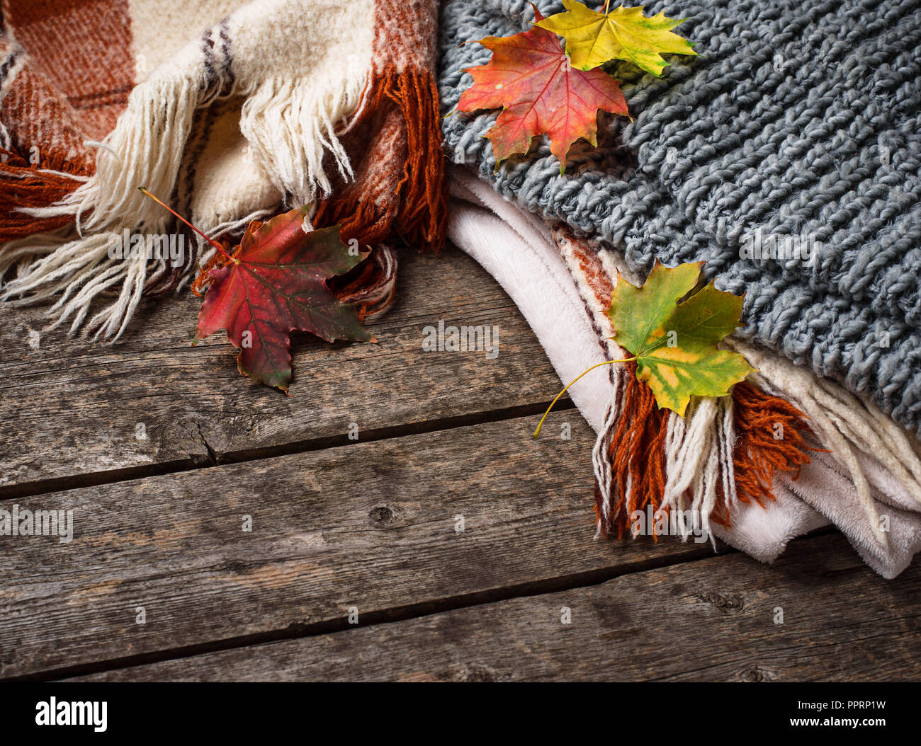 Autumn background with plaid and leaves Stock Photo - Alamy