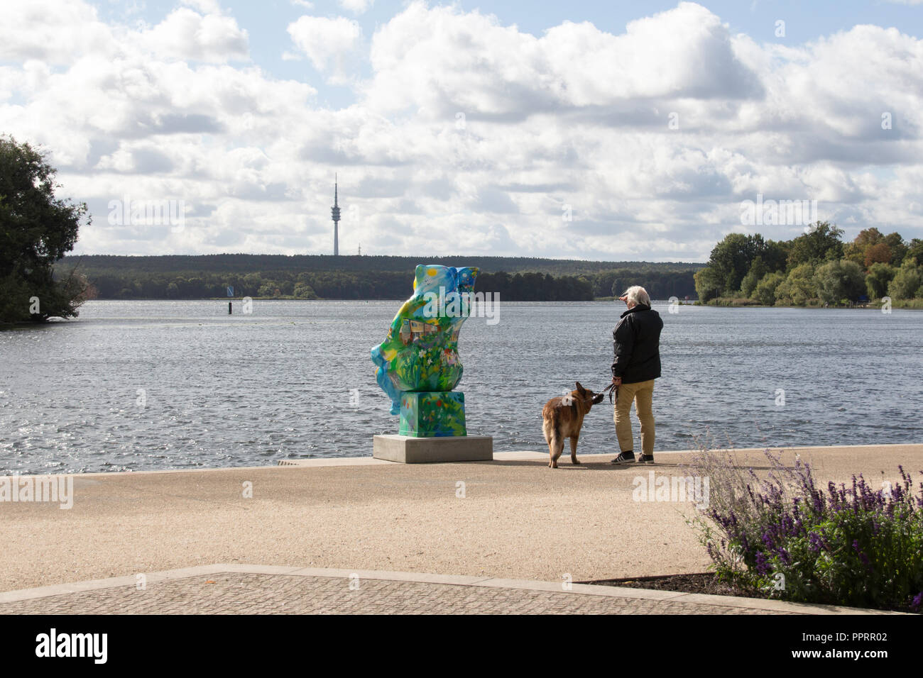 A Buddy Bear a man and his dog by the Havel at Kladow Stock Photo - Alamy