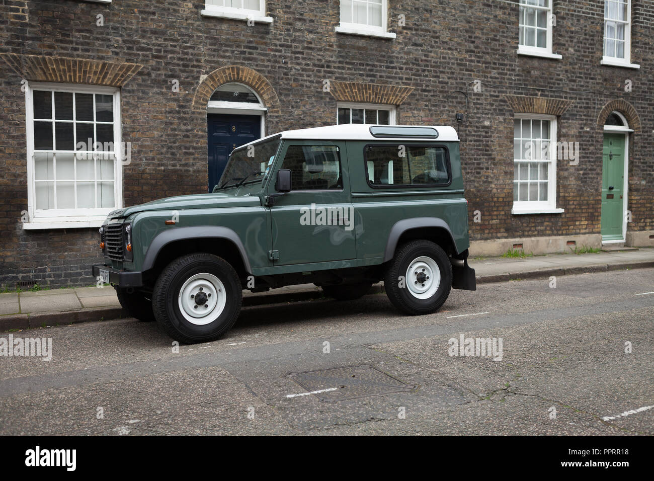 Land Rover parked in front of a row of terraced houses in London Stock ...