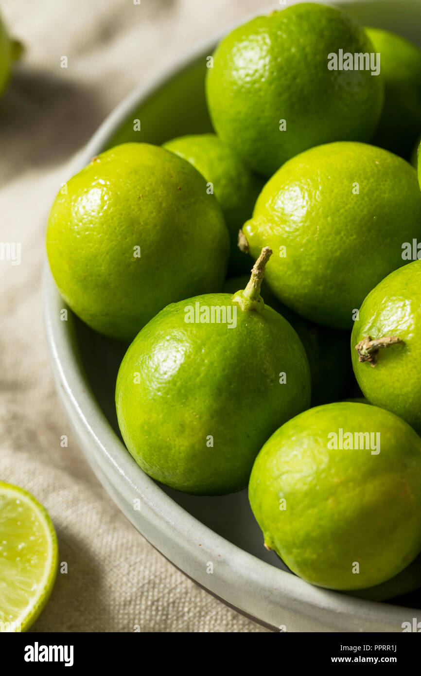 Raw Green Organic Key Limes in a Bowl Stock Photo - Alamy