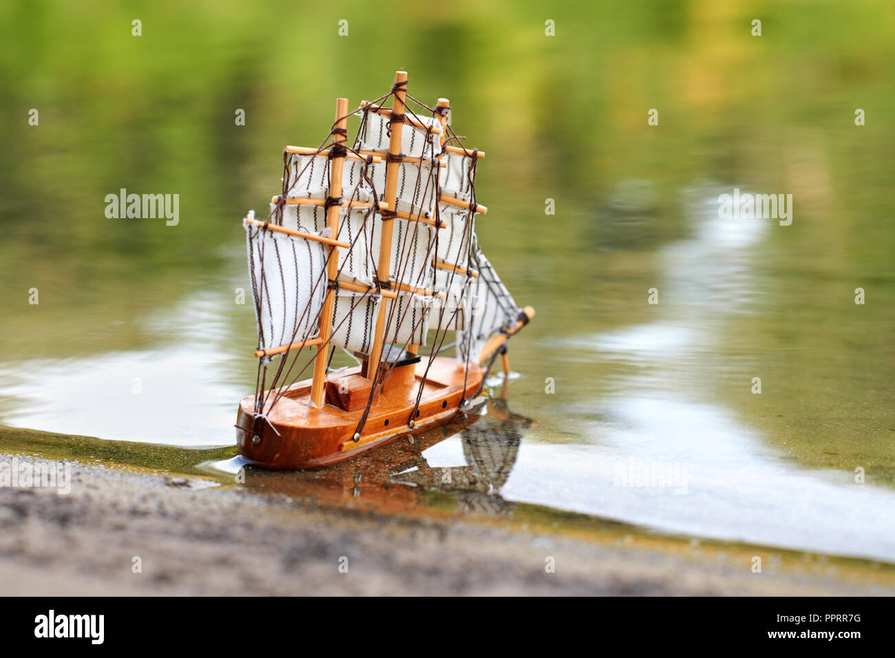 a toy sailing ship in the river Stock Photo - Alamy