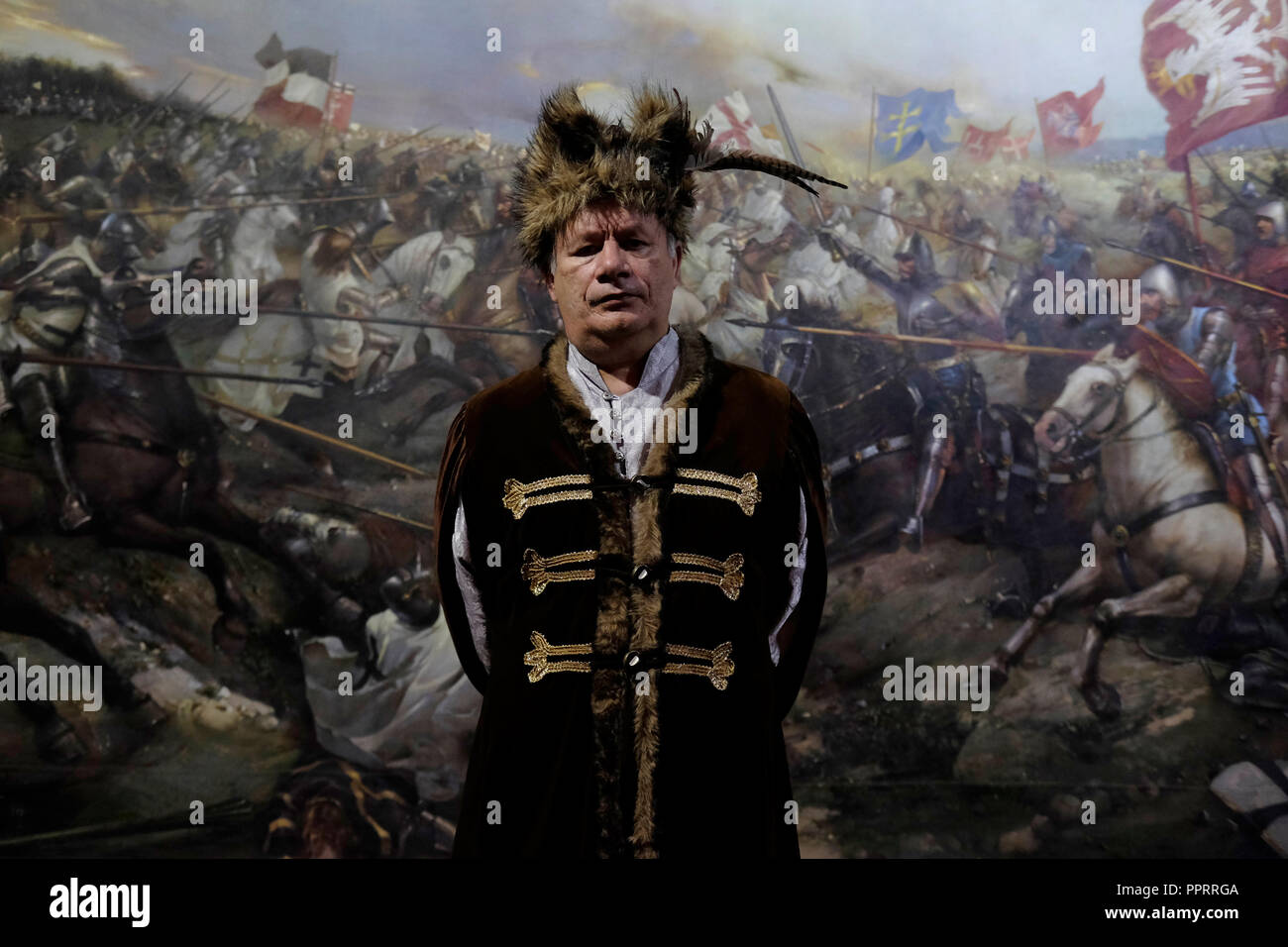 A Polish man wears in traditional medieval garment inside the ...