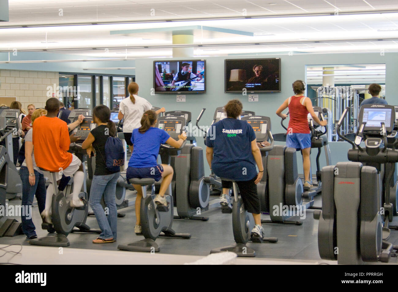Macalester College students working out on stationary bicycles and ...