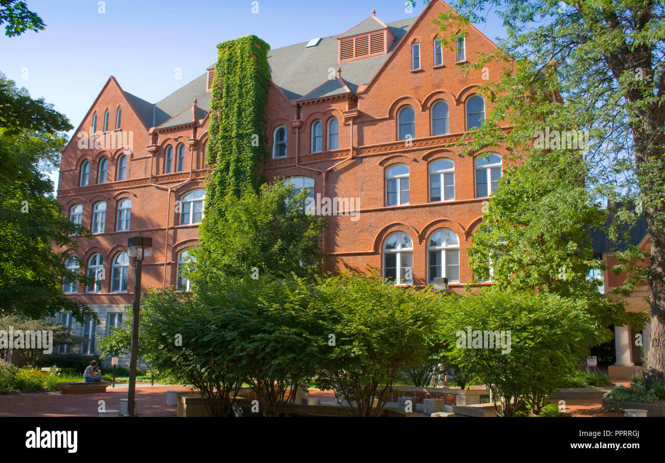 Student reading on bench in back of DeWitt Wallace Library on ...