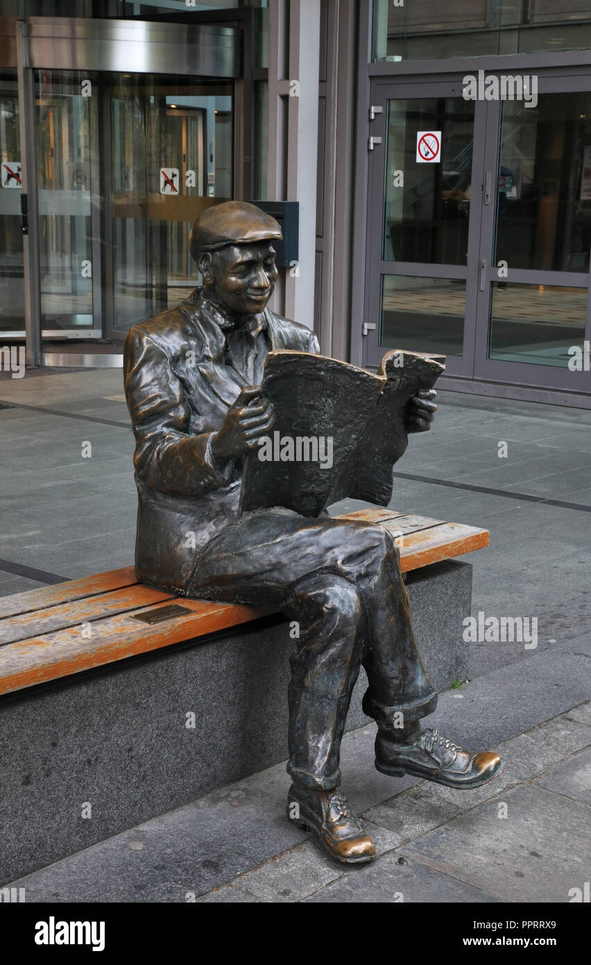 Sculpture of man with newspaper at Akersgata street in Oslo. Norway ...