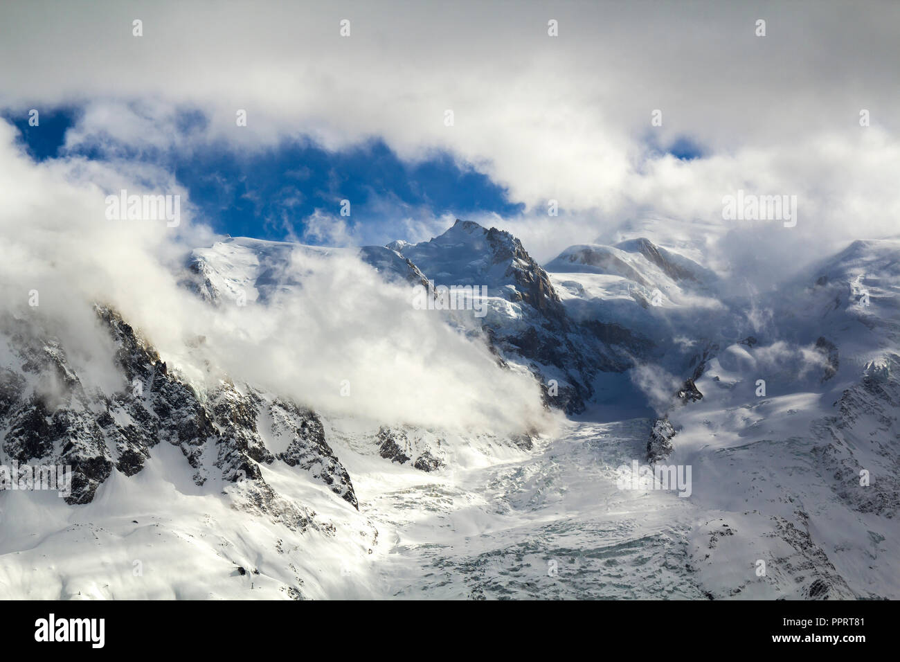 Breathtaking aerial view of Mont Blanc mountain peak covered with shiny ...