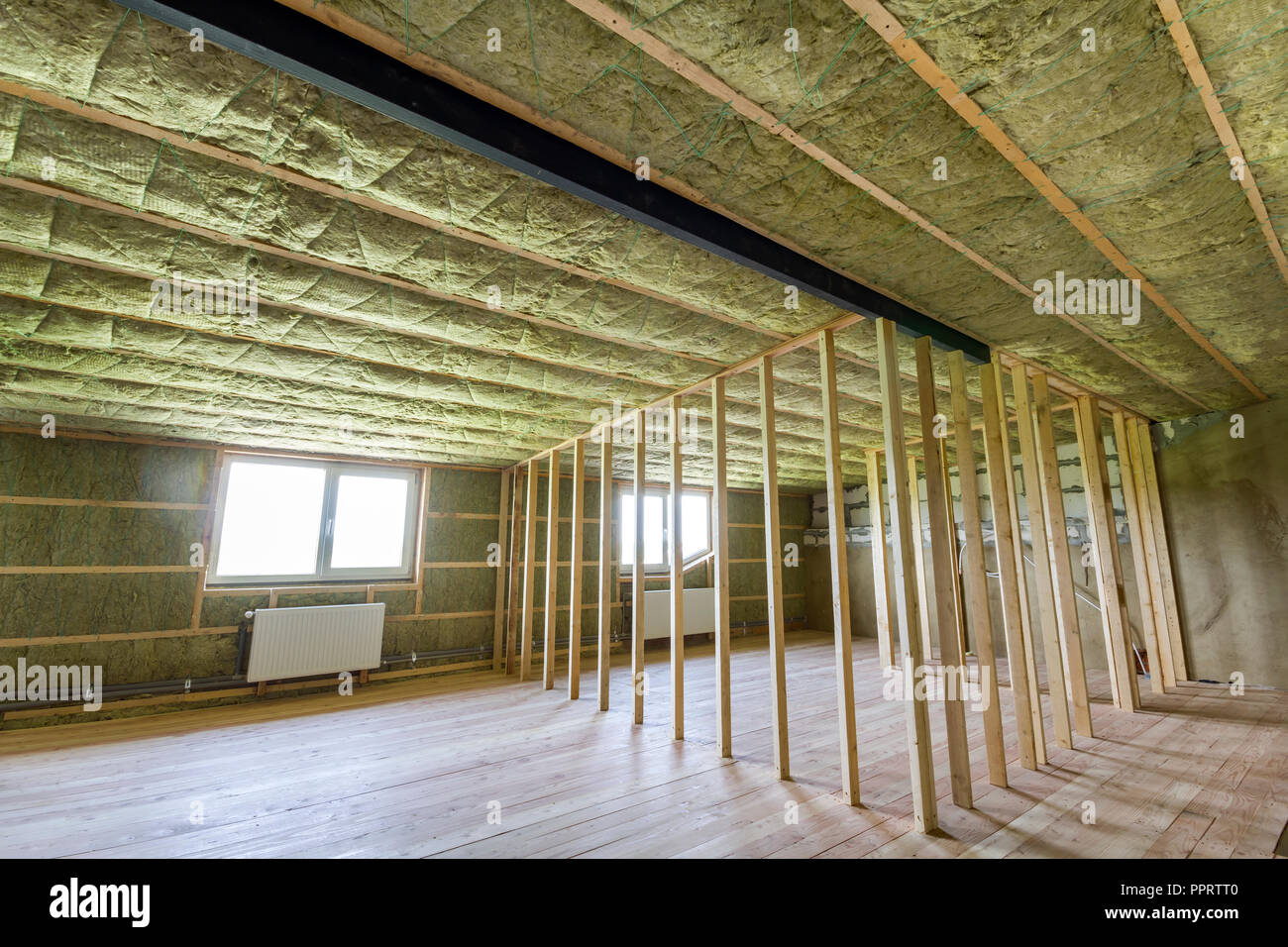 Construction and renovation of big light spacious empty room with oak ...