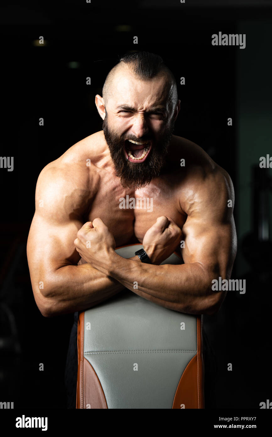 Beard Man Posing In Different Poses Demonstrating His Muscles - Male ...
