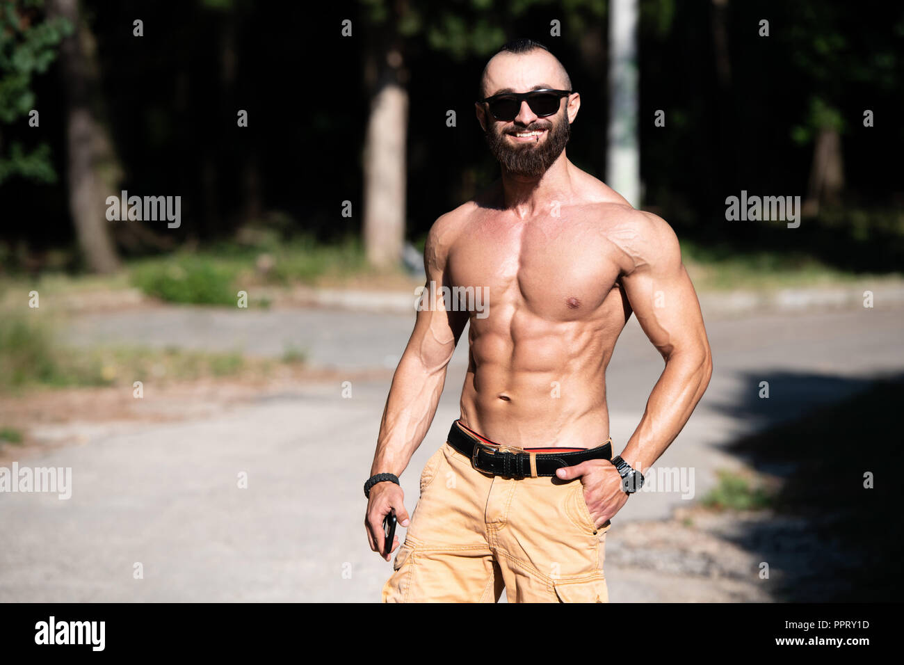 Handsome Beard Man Standing Strong and Posing at Outdoors - Background ...