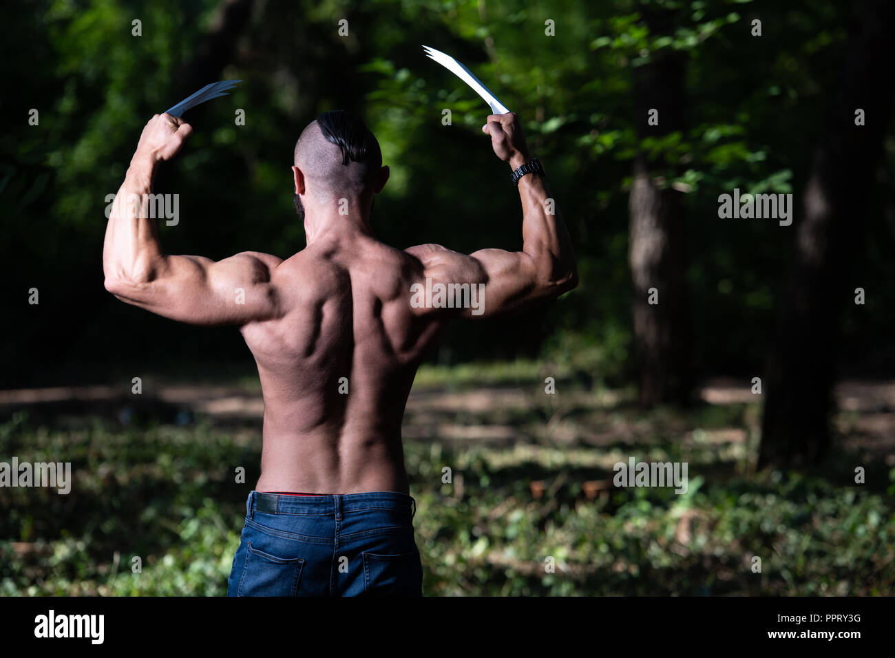 Wolverine With Claws Standing Strong Outdoors and Flexing Muscles ...