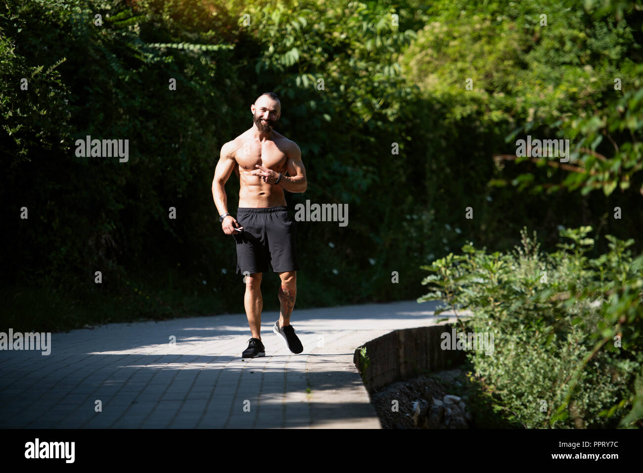 Handsome Beard Man Standing Strong and Posing at Outdoors - Background ...