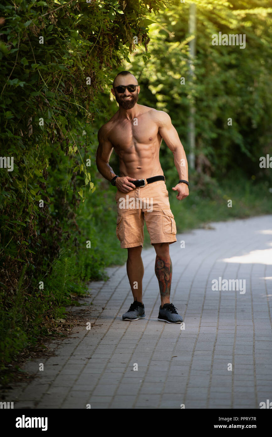 Handsome Beard Man Standing Strong and Posing at Outdoors - Background ...