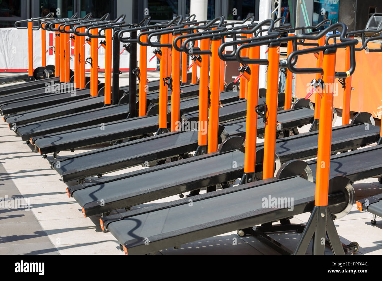 Group of Modern Orange Treadmill in Line in Fitness Center Stock Photo ...