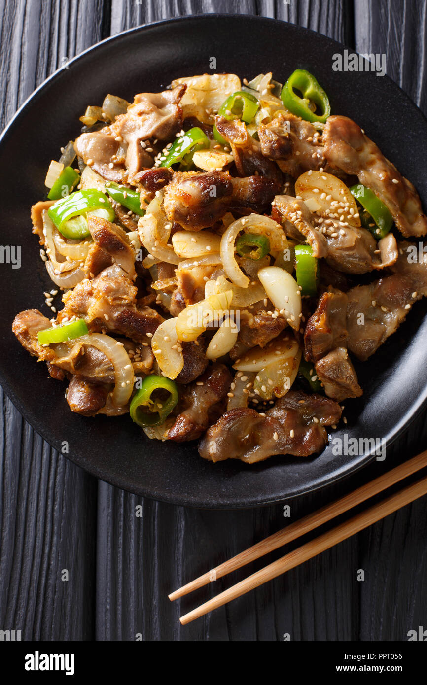 Traditional Korean spicy chicken gizzard with onions, garlic, chili and ...