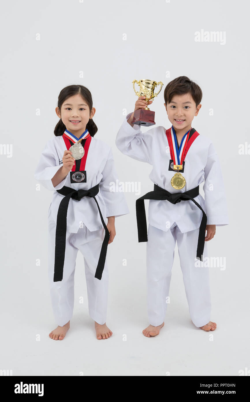 Children education. Taekwondo, little boy and girl practice martial ...