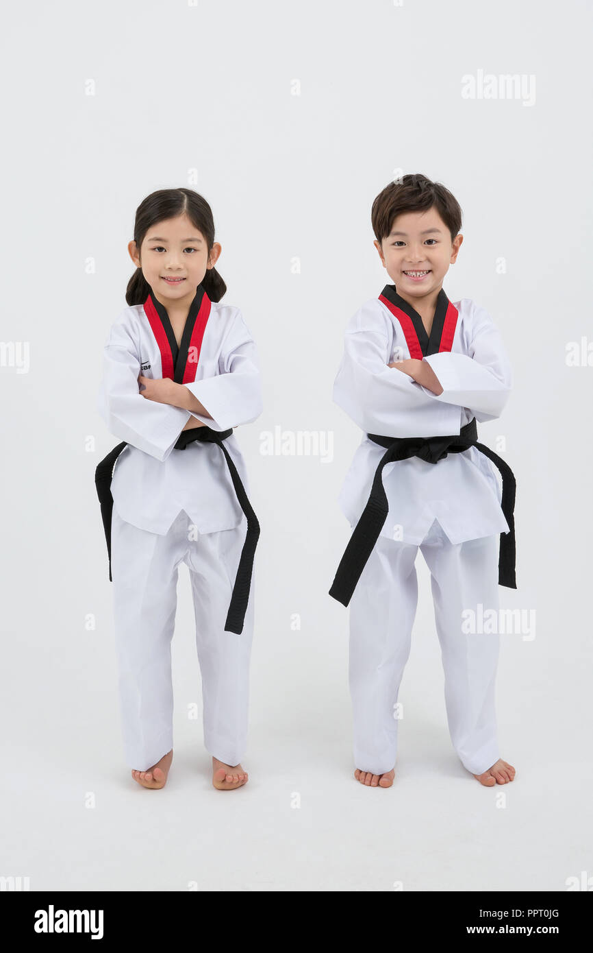 Children education. Taekwondo, little boy and girl practice martial ...