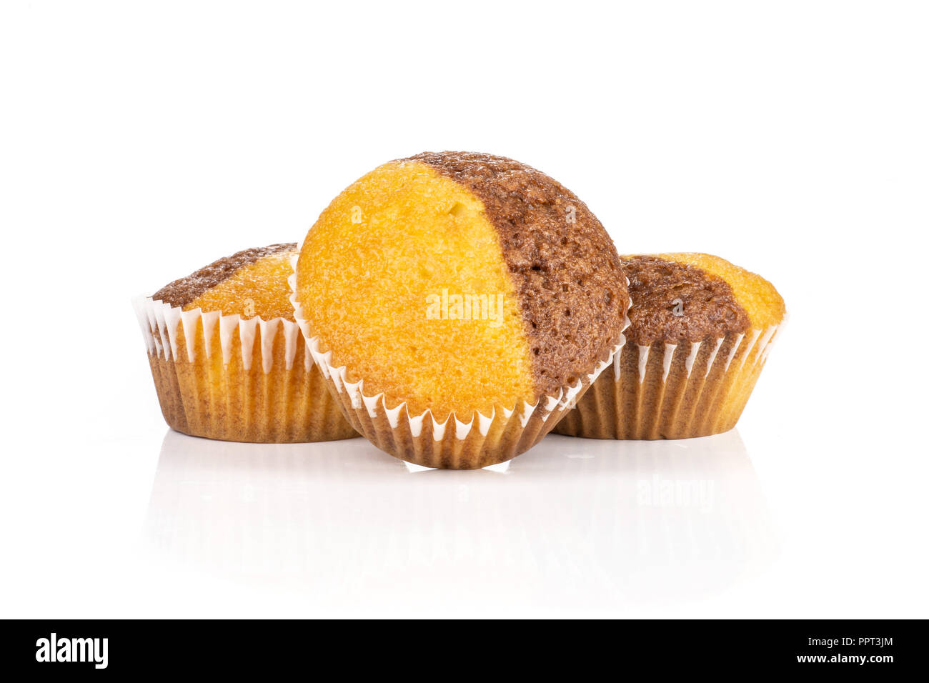 Group of three whole fresh baked marble muffin isolated on white ...