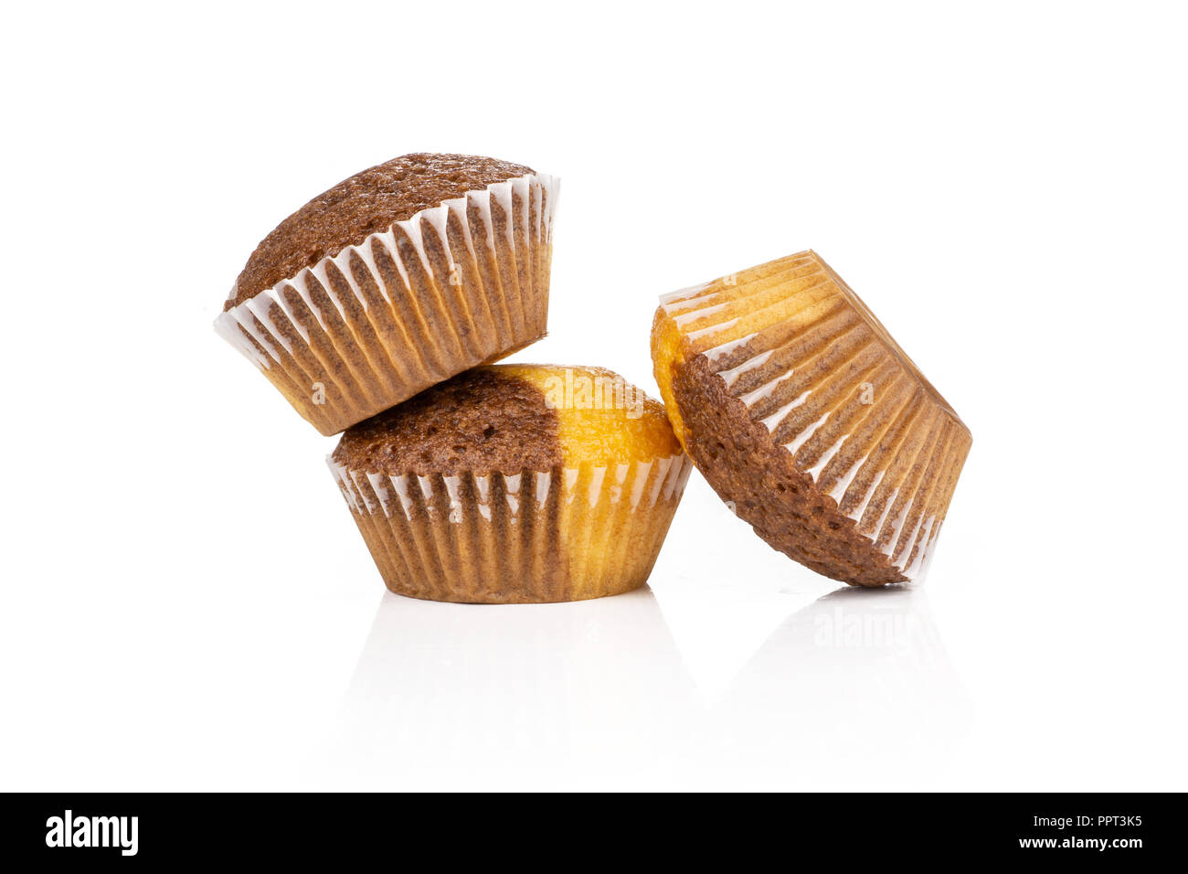 Group of three whole fresh baked marble muffin isolated on white ...