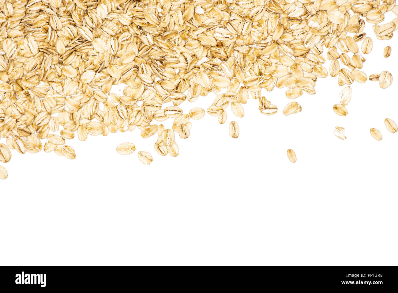 Lot of whole flat raw rolled oats above flatlay isolated on white ...