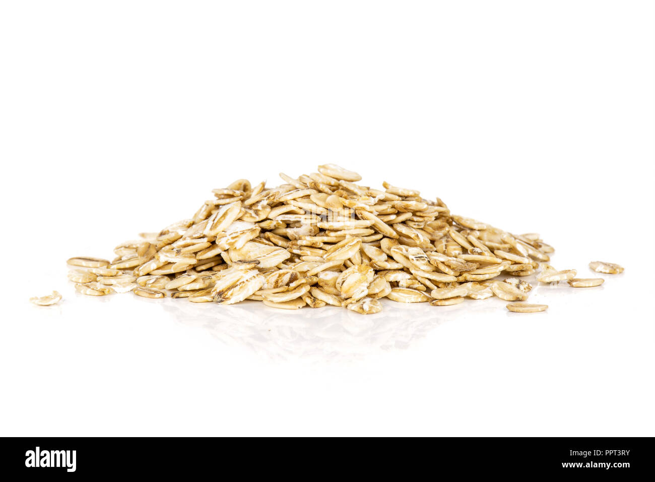 Lot of whole flat raw rolled oats heap isolated on white background ...