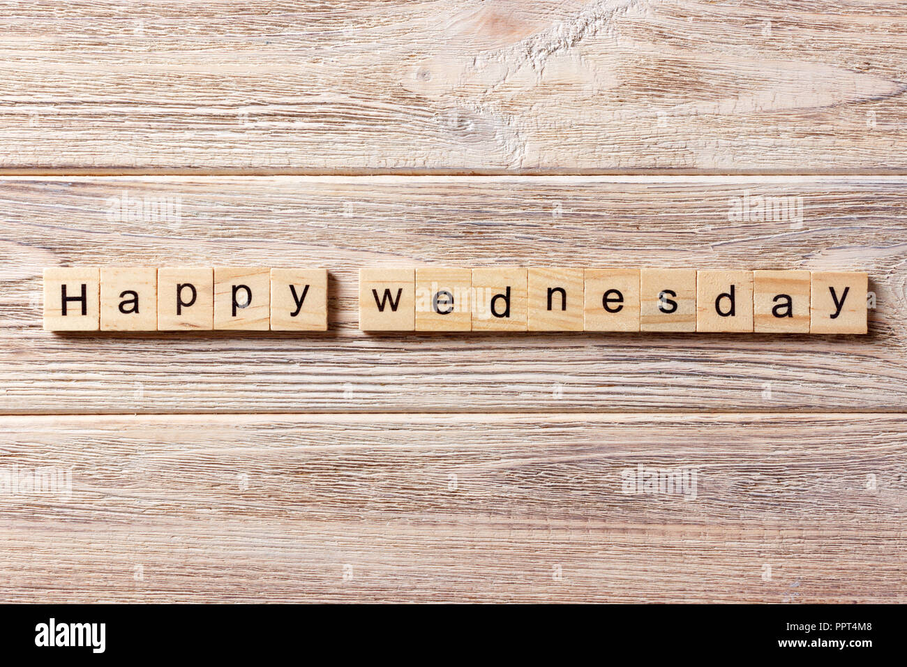 happy wednesday word written on wood block. happy wednesday text on ...