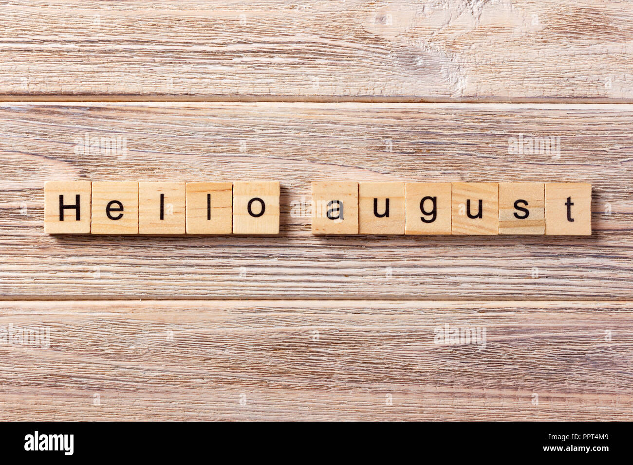 hello august word written on wood block. hello august text on table ...